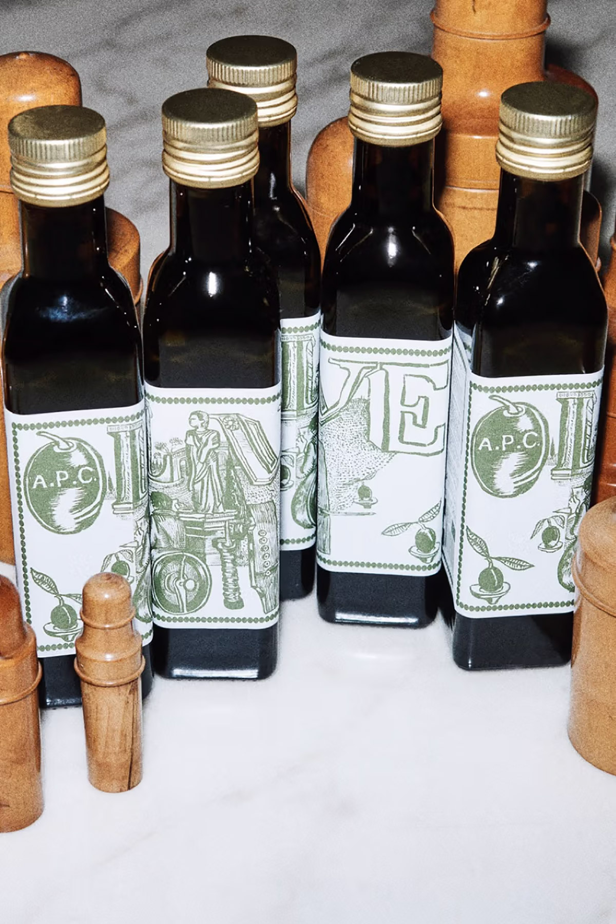 A.P.C. Elevates Olive Oil and Apron Style | The Fashionography ...